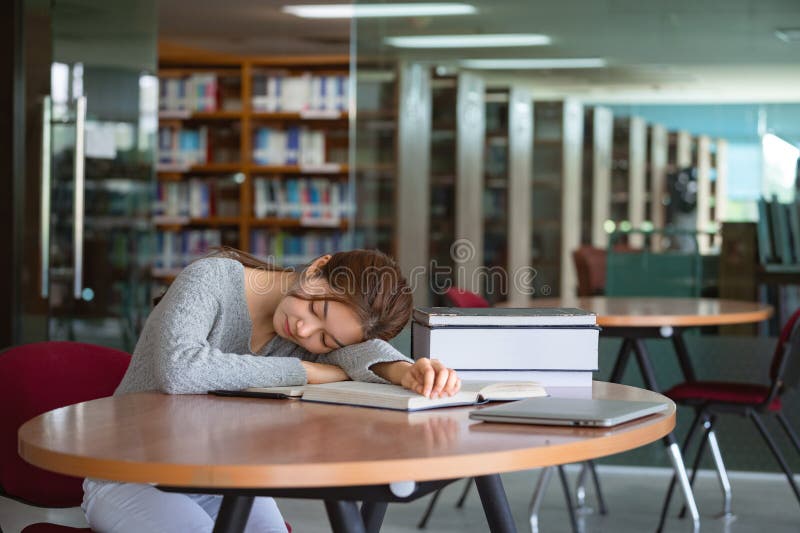 Tired Woman Student Sleeping on Desk in Library Stock Photo - Image of knowledge, dream: 308397536