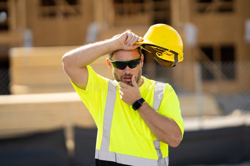 Tired Worker. Worker Man on the Building Construction. Construction ...