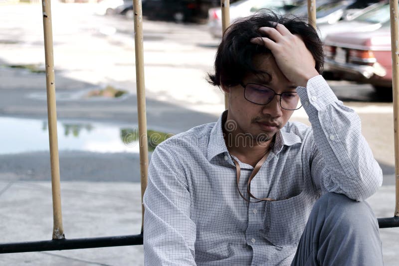 Tired and Worried Young Asian Man Suffering from Severe Depression ...