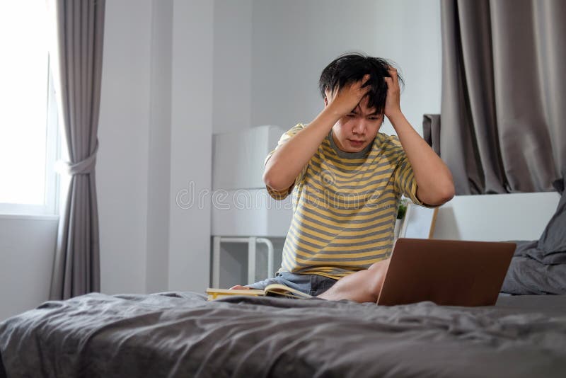 Tired Young Asian Man Working with Computer Laptop on His Bed Stock ...