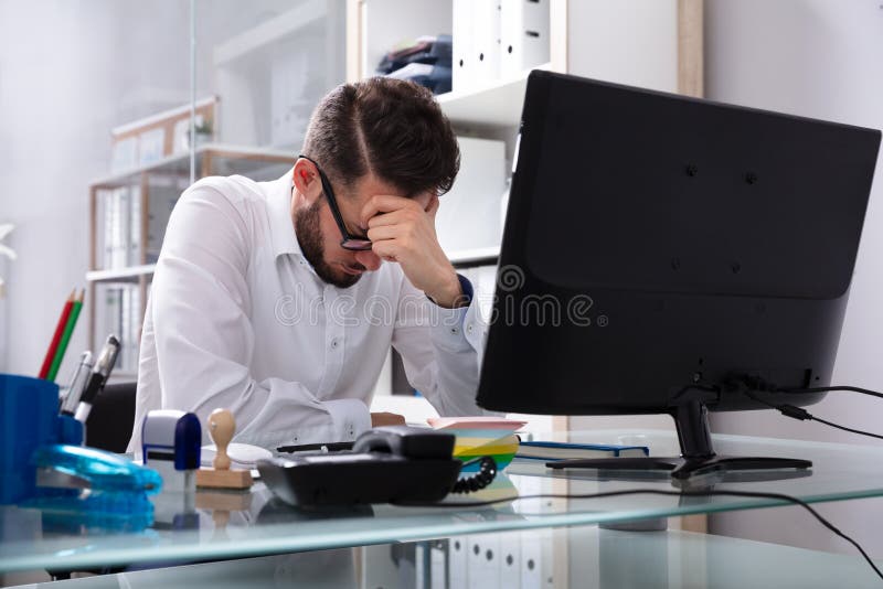 Tired Young Businessman Sitting in Office Stock Image - Image of broken ...