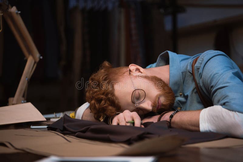 Tired Young Fashion Designer in Eyeglasses Sleeping on Table Stock ...