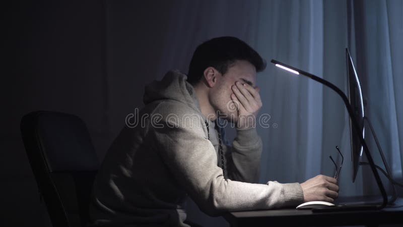 Tired Young Guy Working on Computer at Night, Scratch Eyes Stock Video ...