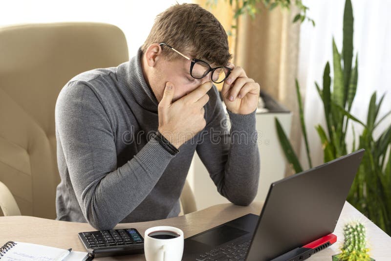 Tired Young Guy Working on Laptop at Table Stock Image - Image of ...