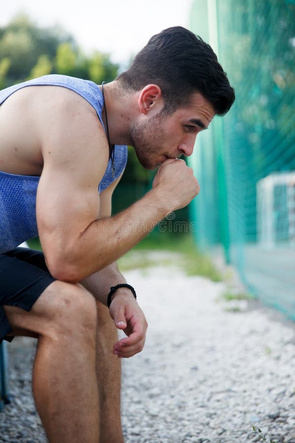 Tired Young Man Sitting on Bench after Jogging Stock Image - Image of ...