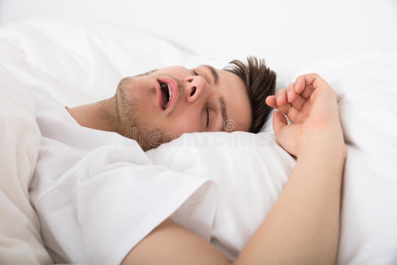Tired Young Man Snoring stock image. Image of male, pillow - 124538395