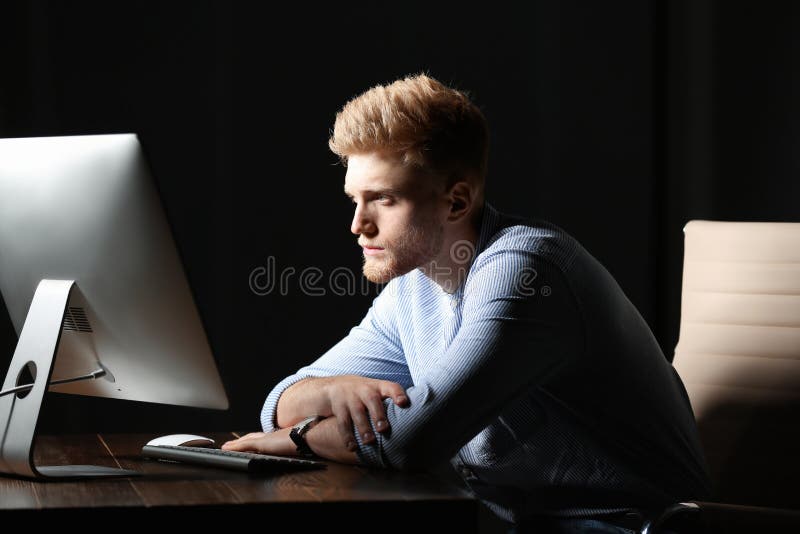 Tired Young Man Working in Office Alone at Stock Image - Image of ...