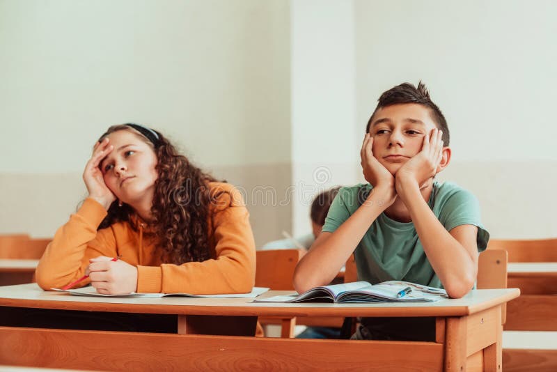 Tired Young Students Sit in the Classroom and Attend School. Selecttive ...