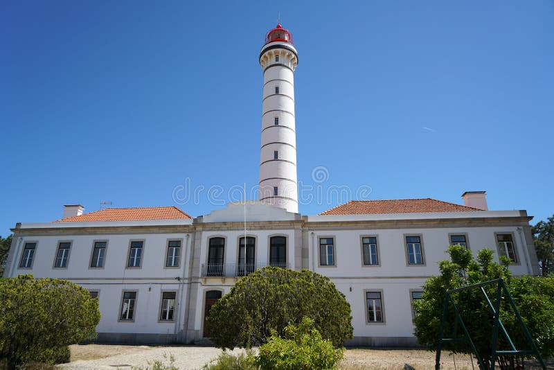 Lighthouse with Lighthouse House Stock Photo - Image of notable, houses ...