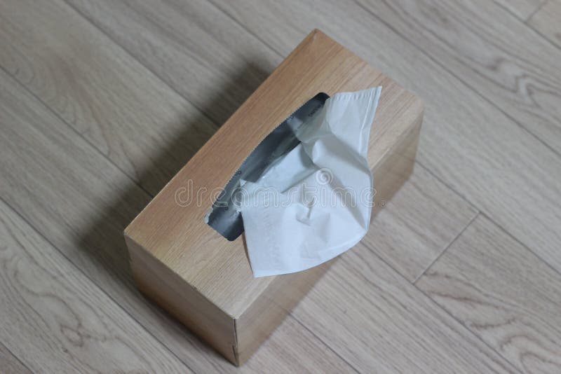 Tissue box on wooden table stock photo. Image of napkin - 222235772