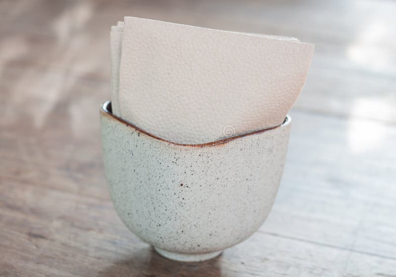 Tissue Paper in Ceramic Cup on Wooden Table Stock Image - Image of ...
