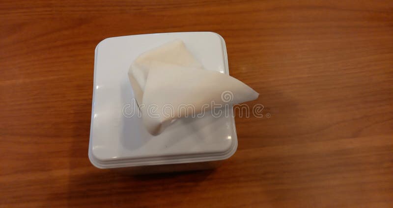 Tissue Paper in a Plastic Box on a Wooden Table Stock Photo - Image of ...
