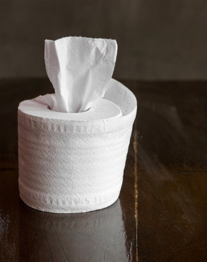 Tissue roll on table stock photo. Image of household - 143815876