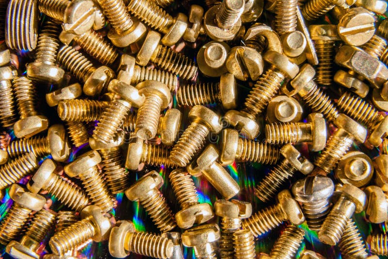 Title:Small bronze bolts stock photo. Image of macro - 64145608