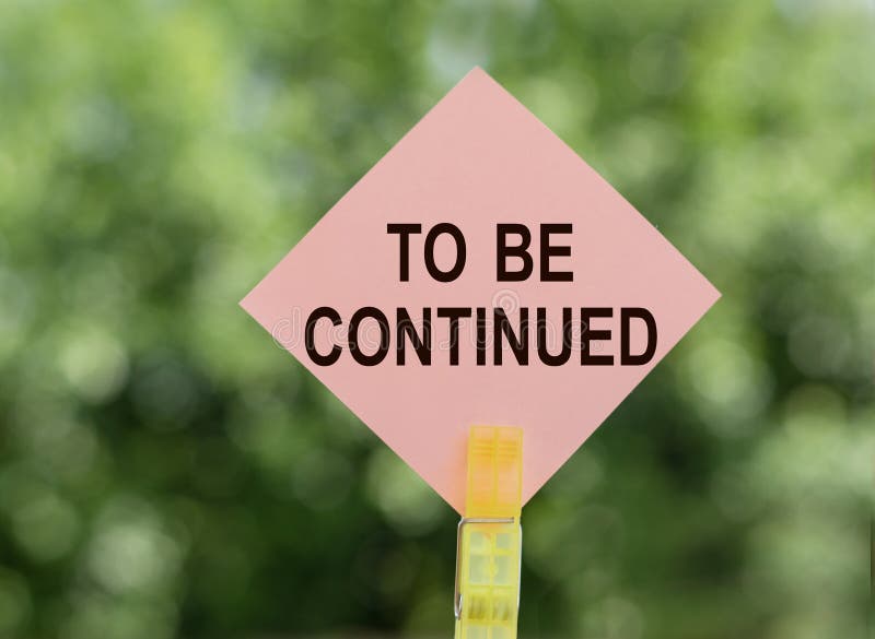 TO BE CONTINUED - Text On Pink Note Paper On Green Background Stock ...