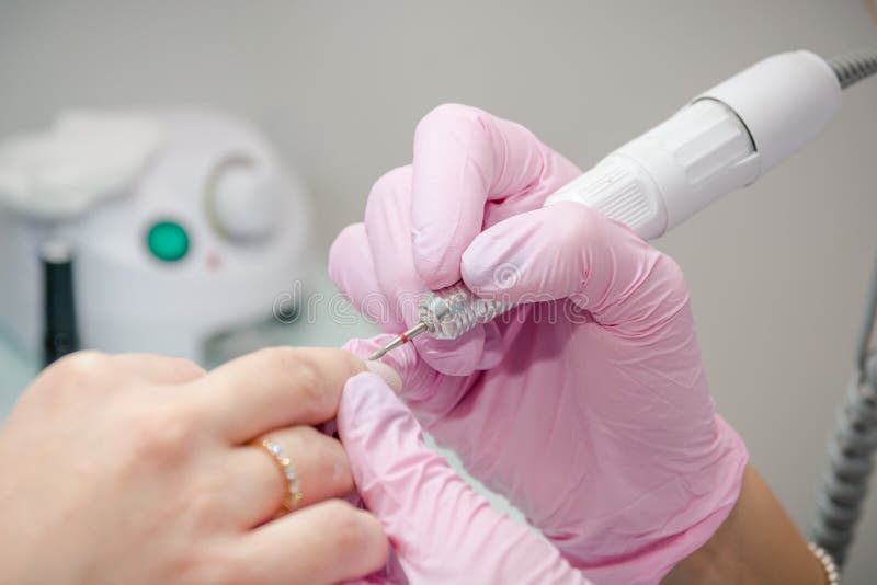 To Cut Nails the Machine. Processing of Nails the Machine in Beauty ...