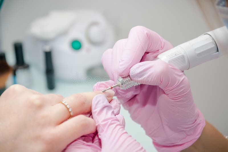 To Cut Nails the Machine. Processing of Nails the Machine in Beauty ...