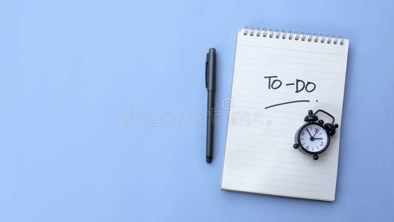 To-Do List with Pen and Alarm Clock on Blue Background Stock Image ...