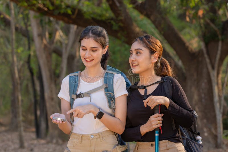 Group of Young People Hiking Trough Forest.Outdoors Nature Concept ...