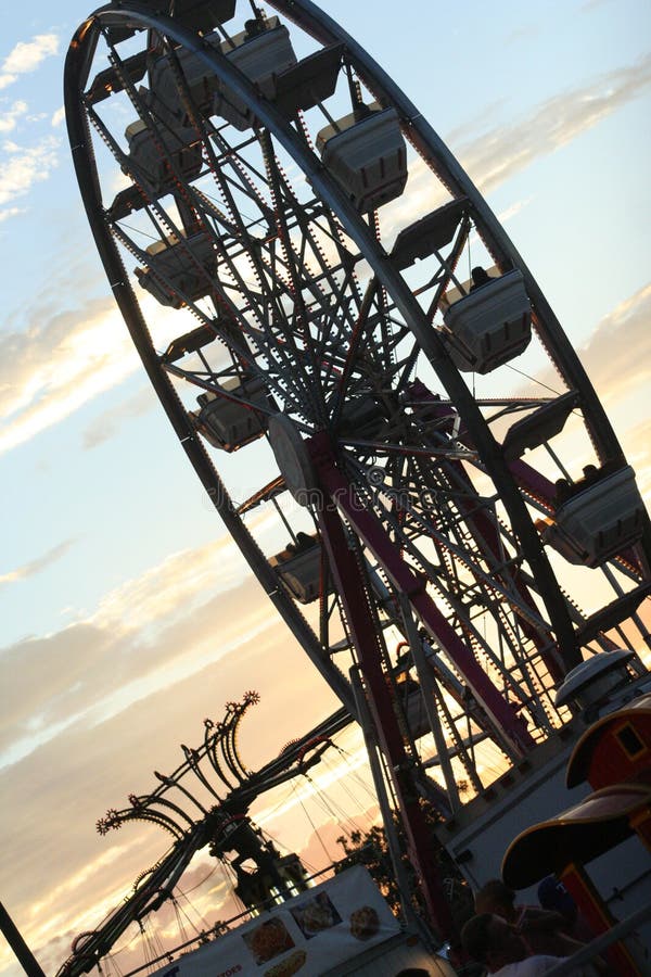 Fair at sunset stock image. Image of summer, rides, fair - 22919