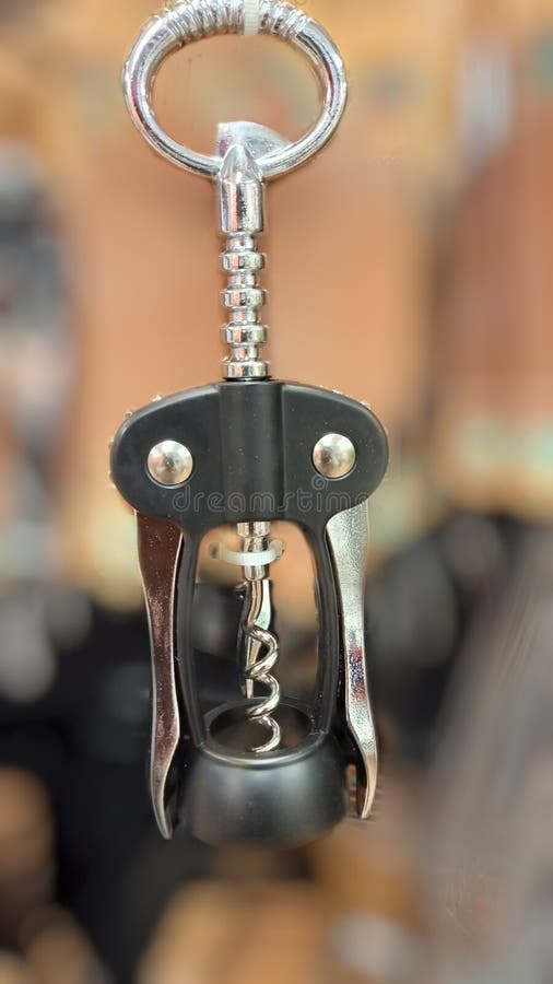 To Open the Cap of a Wine Bottle with a Winged Design, it Makes it ...