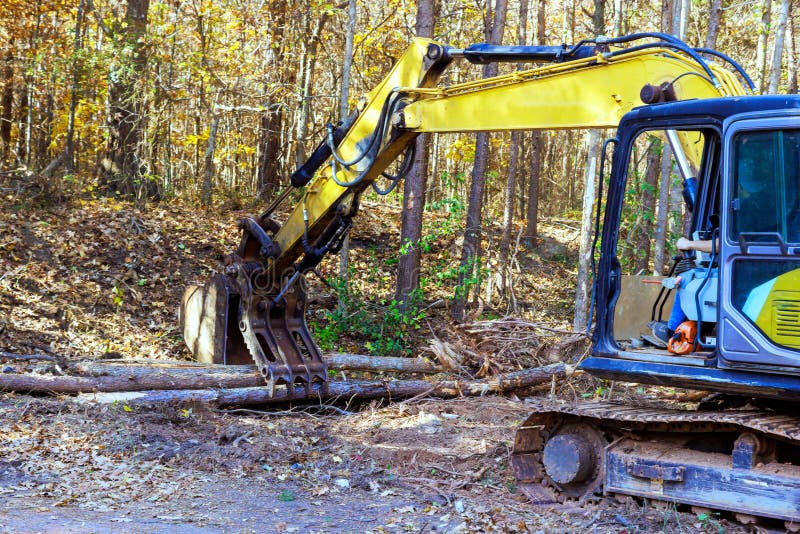 To Prepare for Construction Home Builder Uses a Tractor To Uproot Trees ...