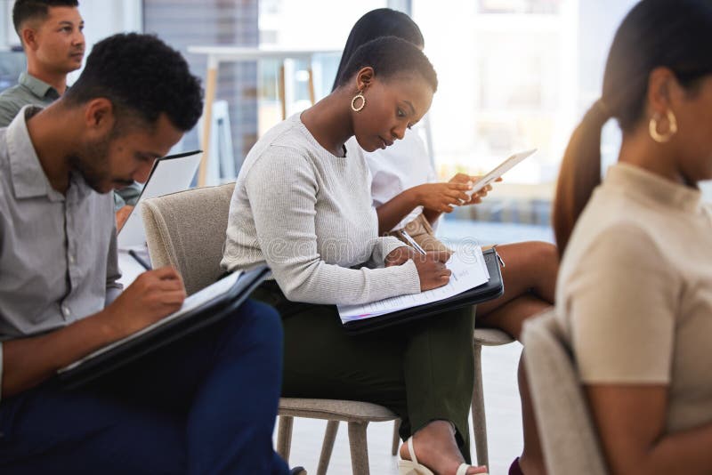 In it To Win it. Employees Taking Notes during a Meeting at Work in a ...