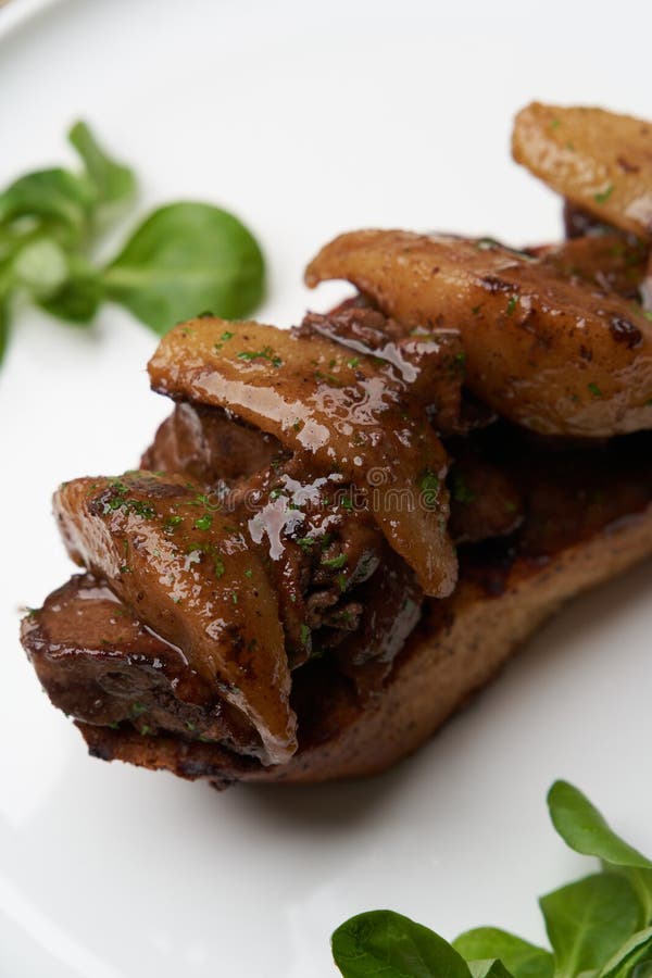 Toast with Baked Chicken Liver on White Plate on Table Stock Image ...