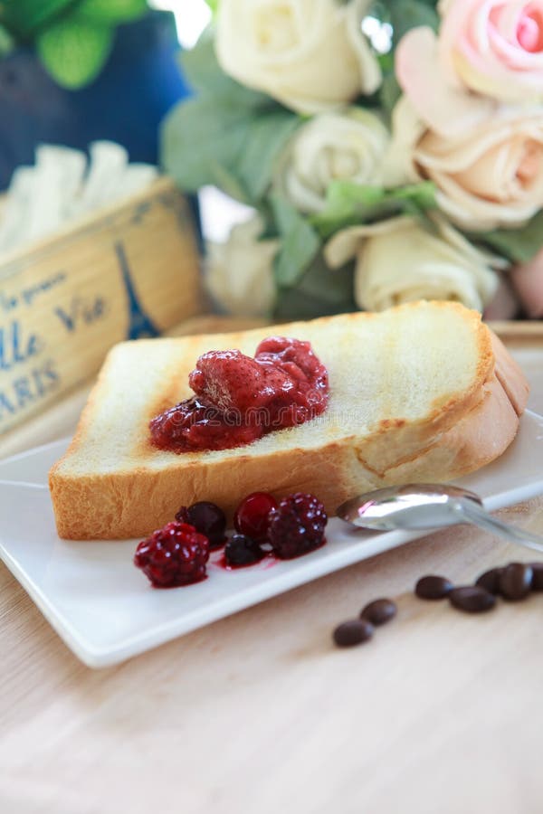 Toast Bread and Sweet Red Strawberry Jam Ready To Eat on Plate Stock ...
