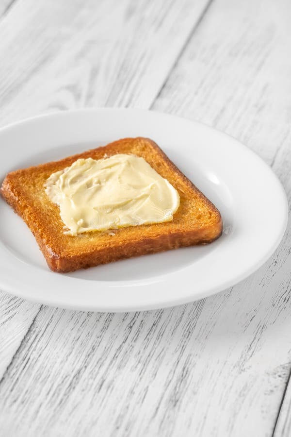 Toast with butter stock image. Image of spread, plate - 259537815