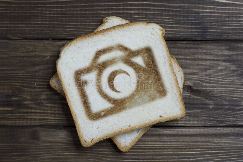 Toast with Camera Sign on Dark Wood Stock Photo - Image of symbol ...