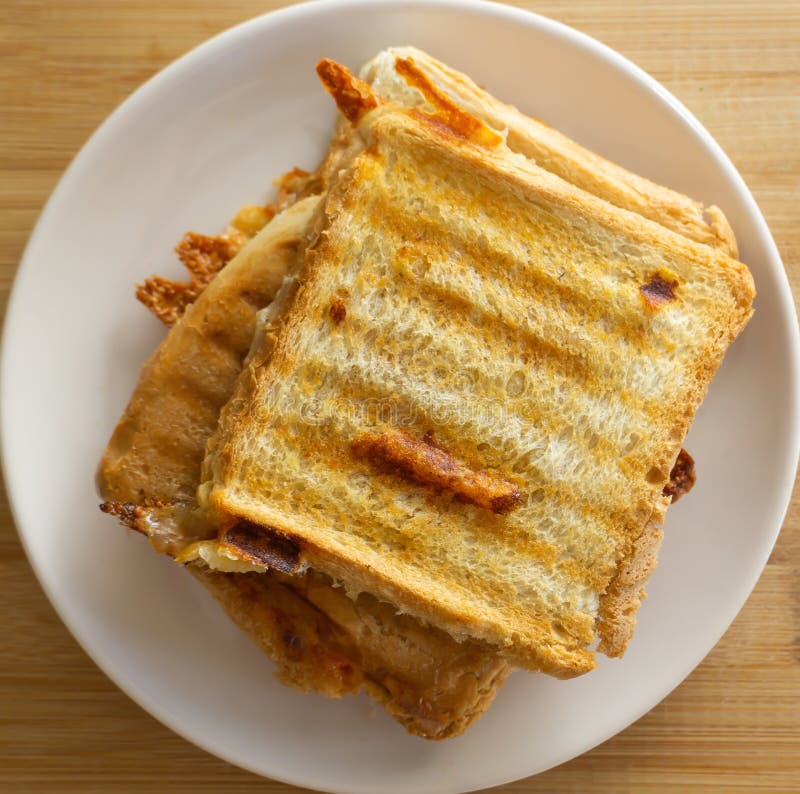 Toast with Cheddar Cheese in White Plate Stock Photo - Image of ...