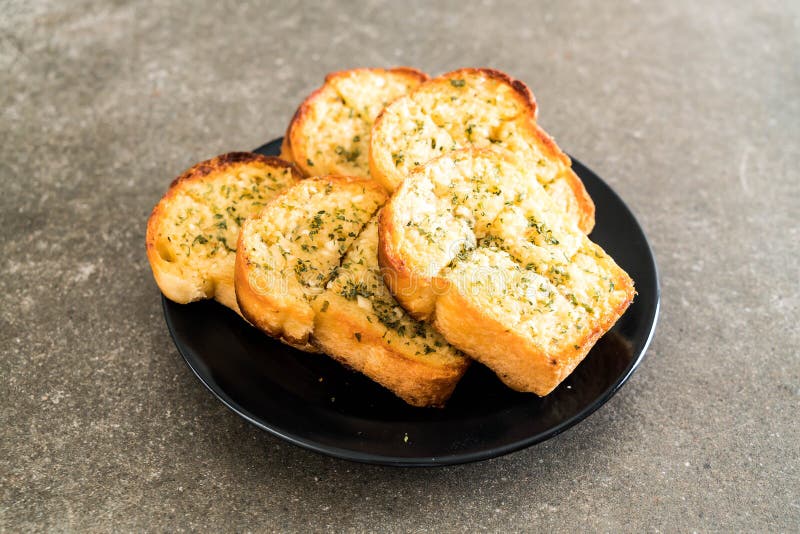 Garlic bread on plate stock photo. Image of food, garlic - 105677606