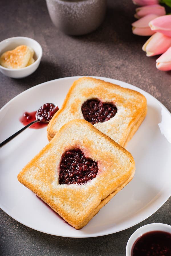 Toast with a Heart Filled with Raspberry Jam on a Plate. Breakfast for ...