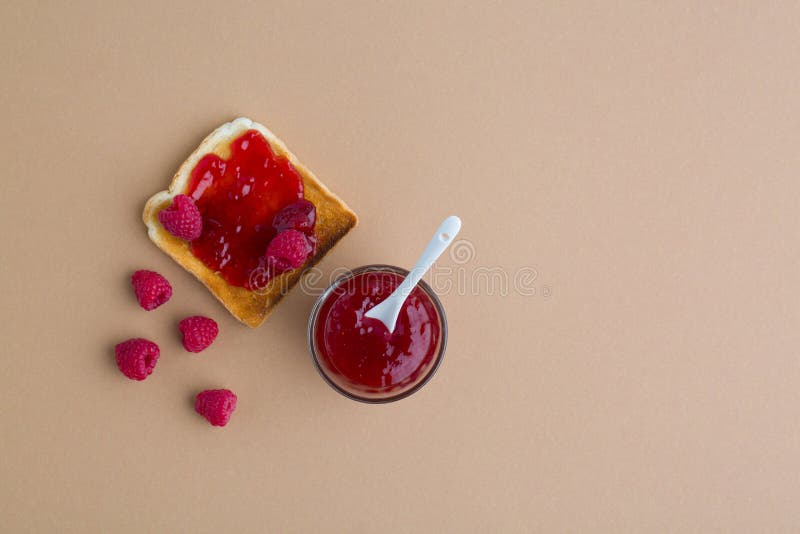 Toast with Jam and Raspberry on Beige Table. Top View Stock Image ...