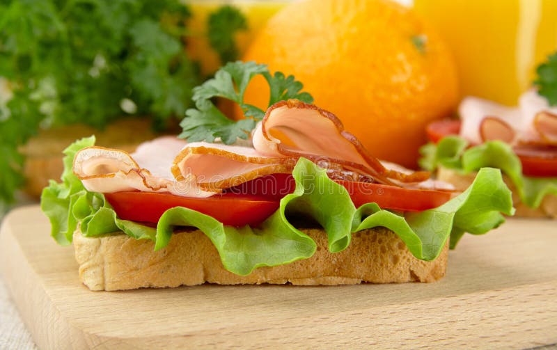 Toast on Plate with Orange in the Background on Cutting Board Stock ...