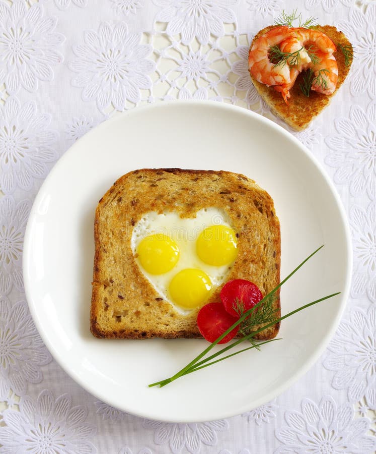 Toast with Quail Eggs in the Form Stock Photo - Image of green, meal ...