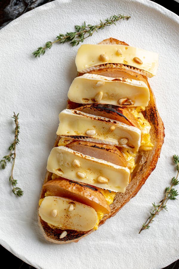 Toast with Scrambled Egg Pear and Brie Stock Photo - Image of portion ...