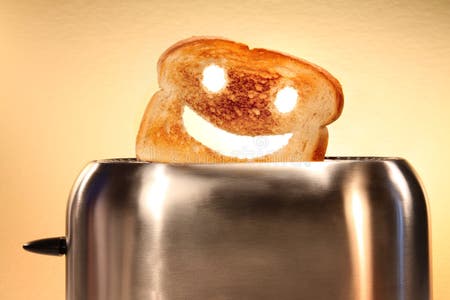 Toast with Smiley Face in Toaster Stock Image - Image of golden, bright ...
