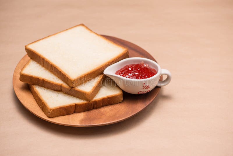 Toast with Strawberry Jam on a Plate on Table Stock Photo - Image of ...