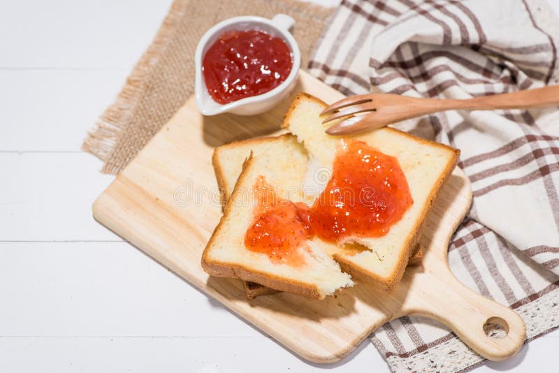 Toast with Strawberry Jam on a Plate on Table. Stock Image - Image of ...