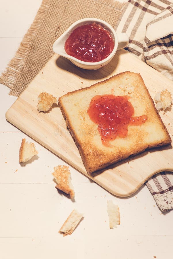 Toast with Strawberry Jam on a Plate on Table. Stock Photo - Image of ...