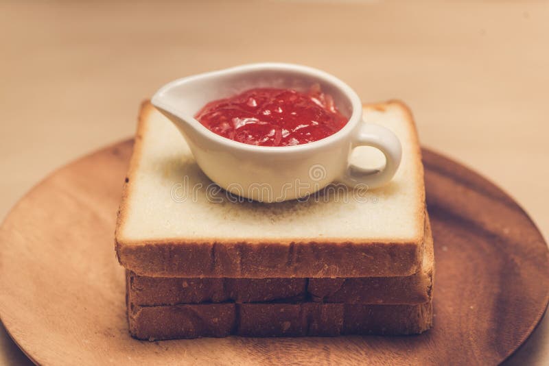 Toast with Strawberry Jam on a Plate on Table. Stock Image - Image of ...