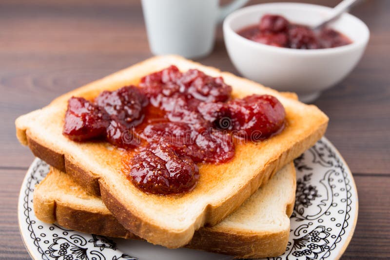 Toast with strawberry jam stock photo. Image of table - 33513546