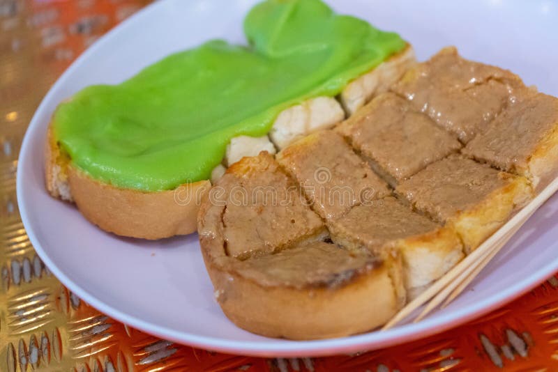 Toast with Thai Pandan Custard and Chocolate Custard on Plate Stock ...