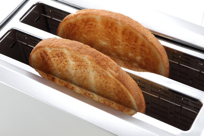 Toast in a Toaster Two Slices Golden Brown Stock Photo - Image of ...