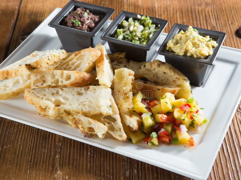 Toasted Artisan Bread with Salsa and Dips Appetizer Stock Photo - Image ...