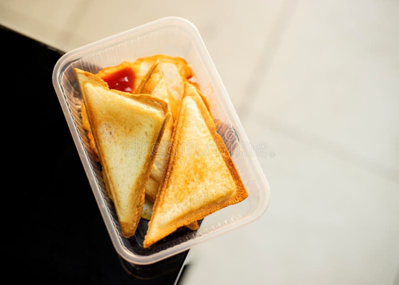Toasted Bread Photos, in a Plastic Box. Stock Image - Image of ...