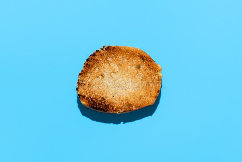Toasted Bread Slice Above View on Blue Background. Baguette Bread ...