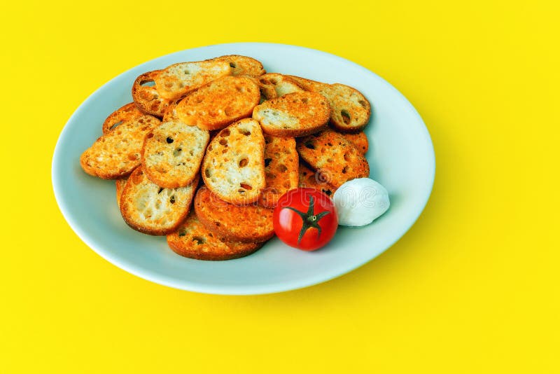 Toasted Bread Slices with Tomato and Mozzarella Flavor on a Yellow ...